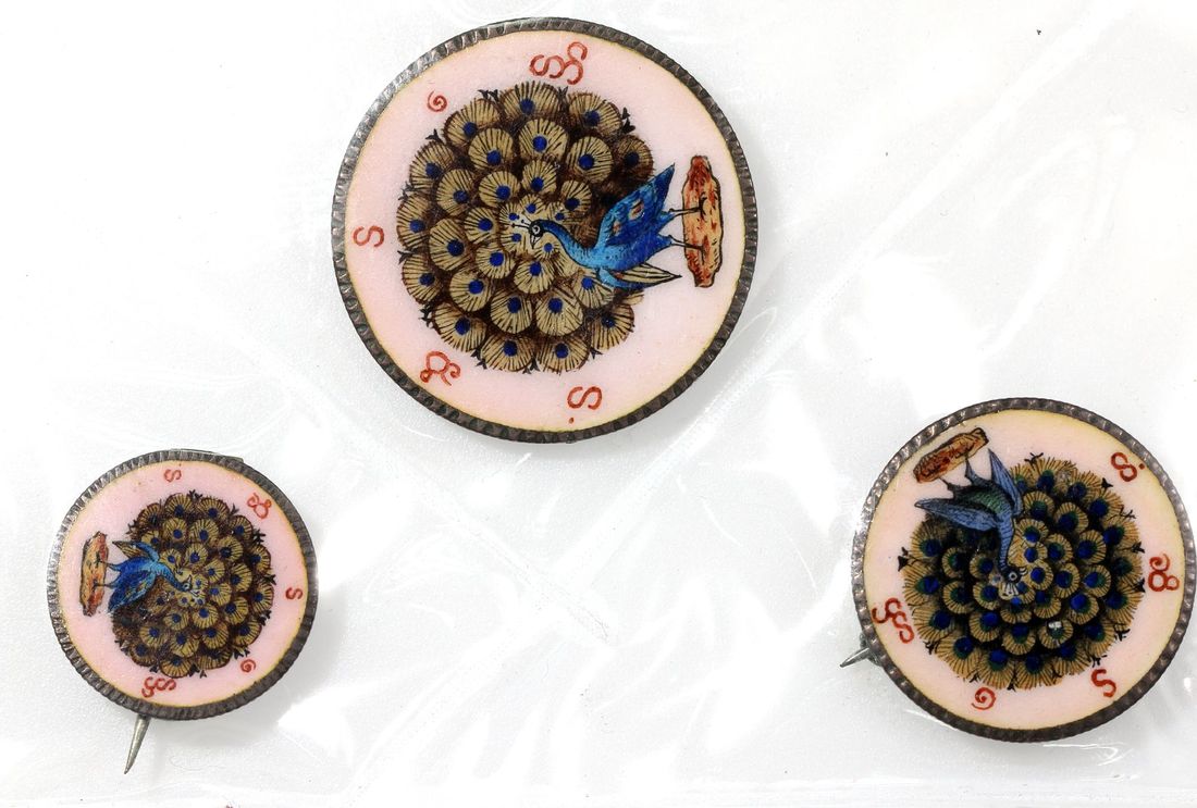Burma, a trio of enamel brooch pins made of silver 'Peacock' coins ...