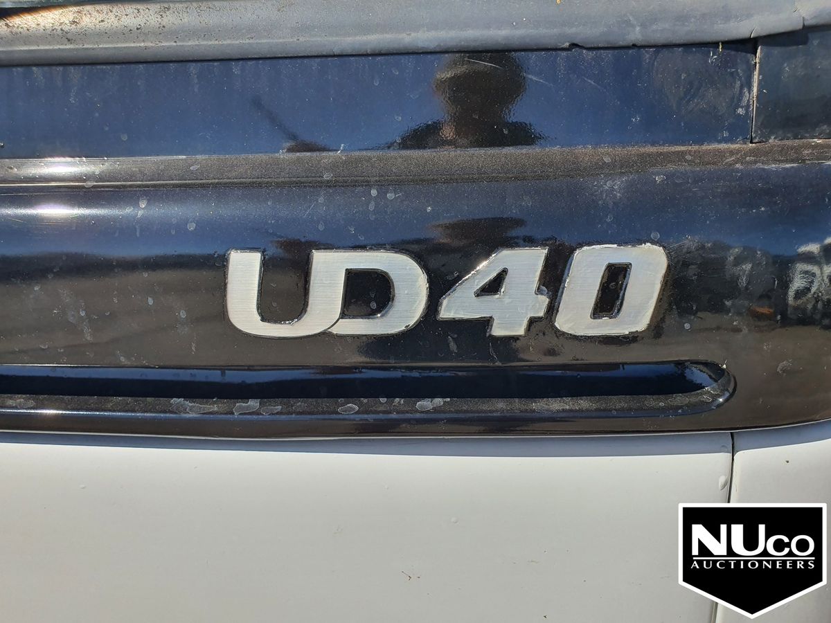 NISSAN UD40 4X2 DROPSIDE TRUCK WITH FASSI F38 CRANE | NUco Auctioneers