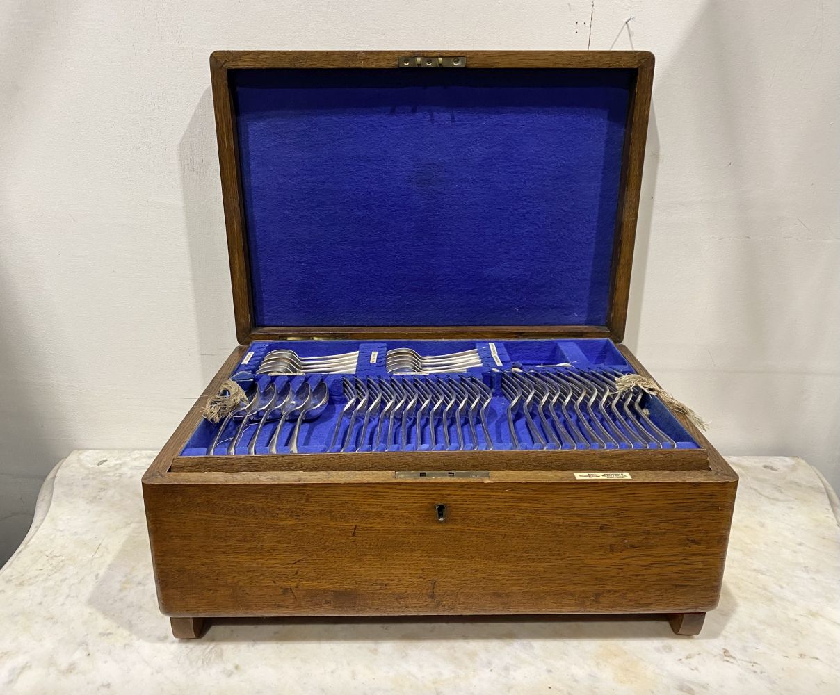 A HARDWOOD CASED CANTEEN OF SILVER-PLATE CUTLERY, by Walker & Hall Ltd ...