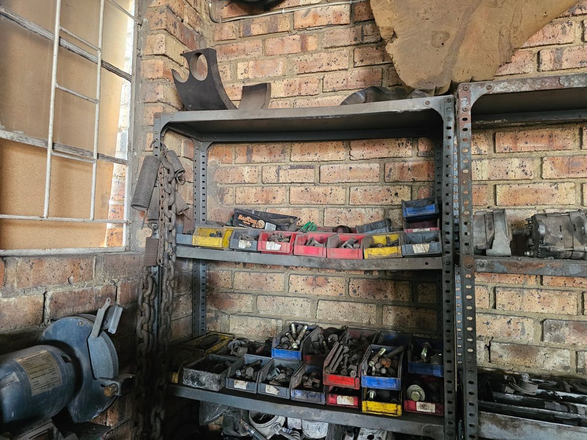 LOT OF TWO (2) STEEL RACKS WITH TABLE & VARIOUS WORKSHOP SPARES | Panabid