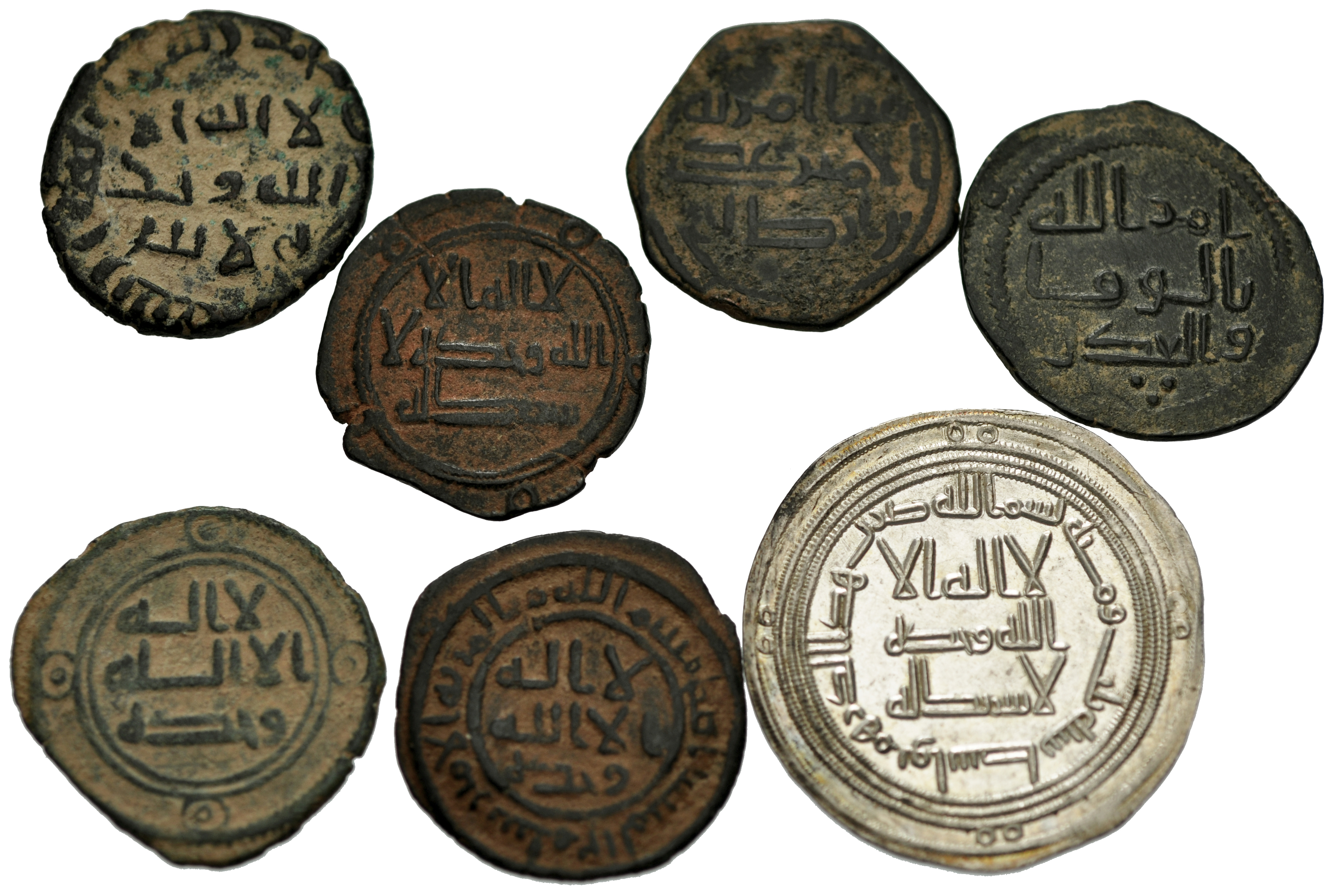ISLAMIC. UMAYYAD. Lot of six (6) Æ Fulus, all Eastern mints, and a ...