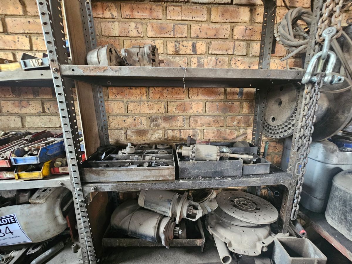 LOT OF TWO (2) STEEL RACKS WITH TABLE & VARIOUS WORKSHOP SPARES | Panabid