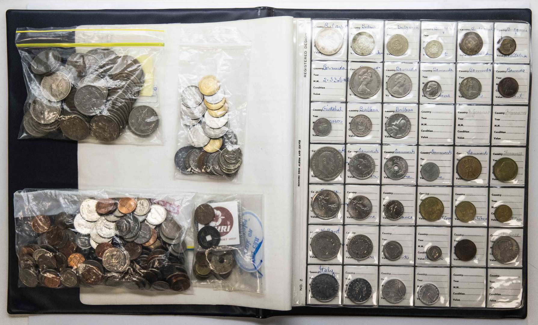 World Accumulation compr plastic page album containing coins (298) from ...
