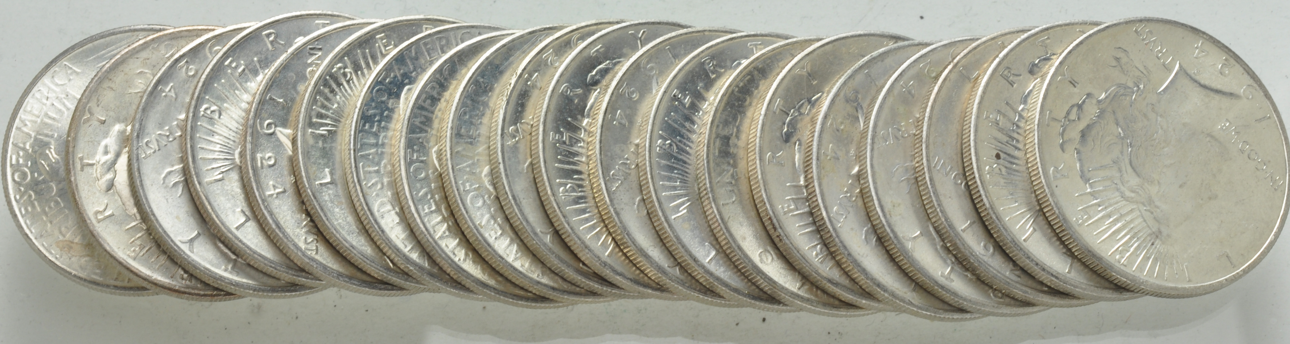 1924 Peace Dollars. One original Uncirculated roll of twenty (20) coins ...