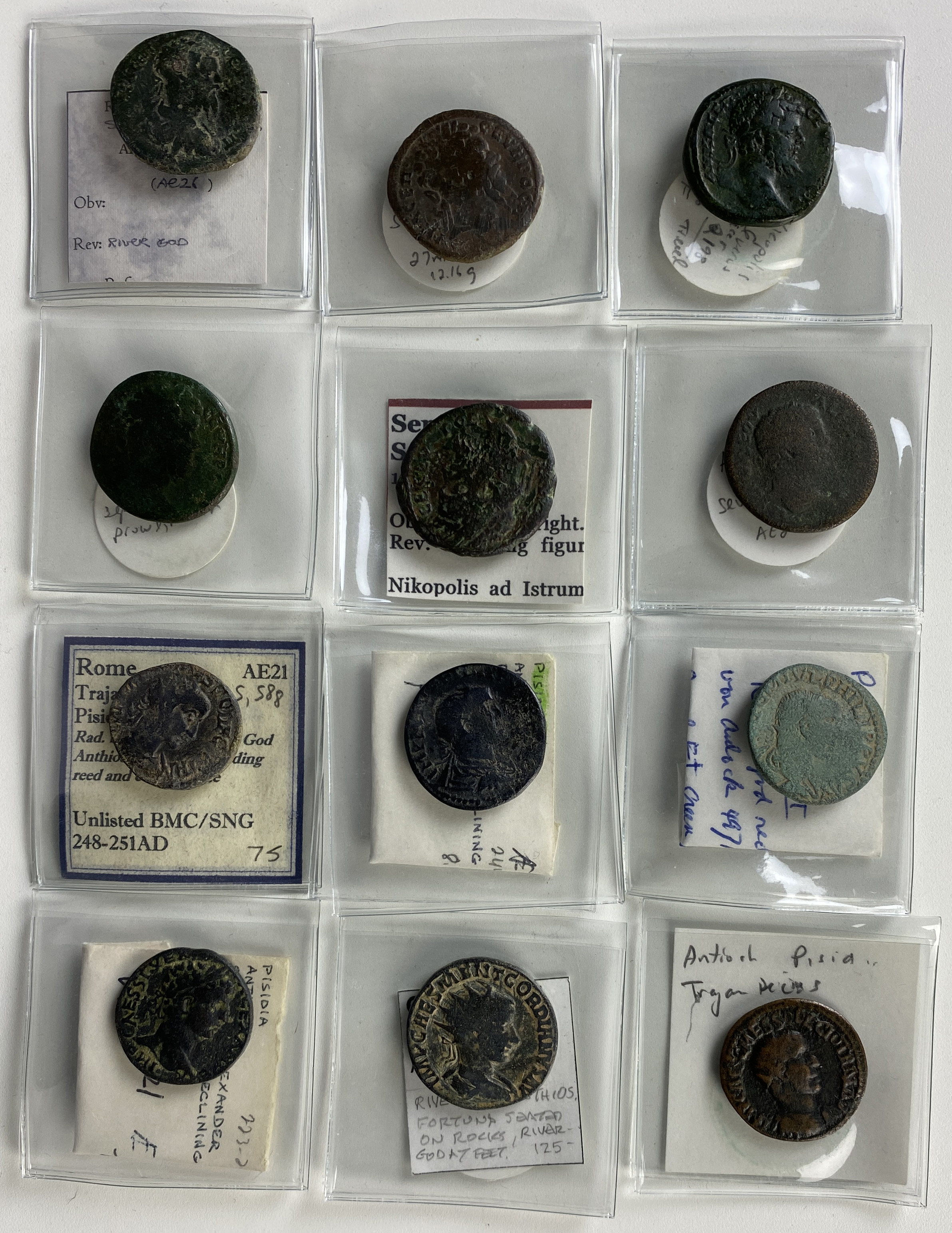 ROMAN. Provincial. Lot of twelve (12) bronze issues with river-god ...