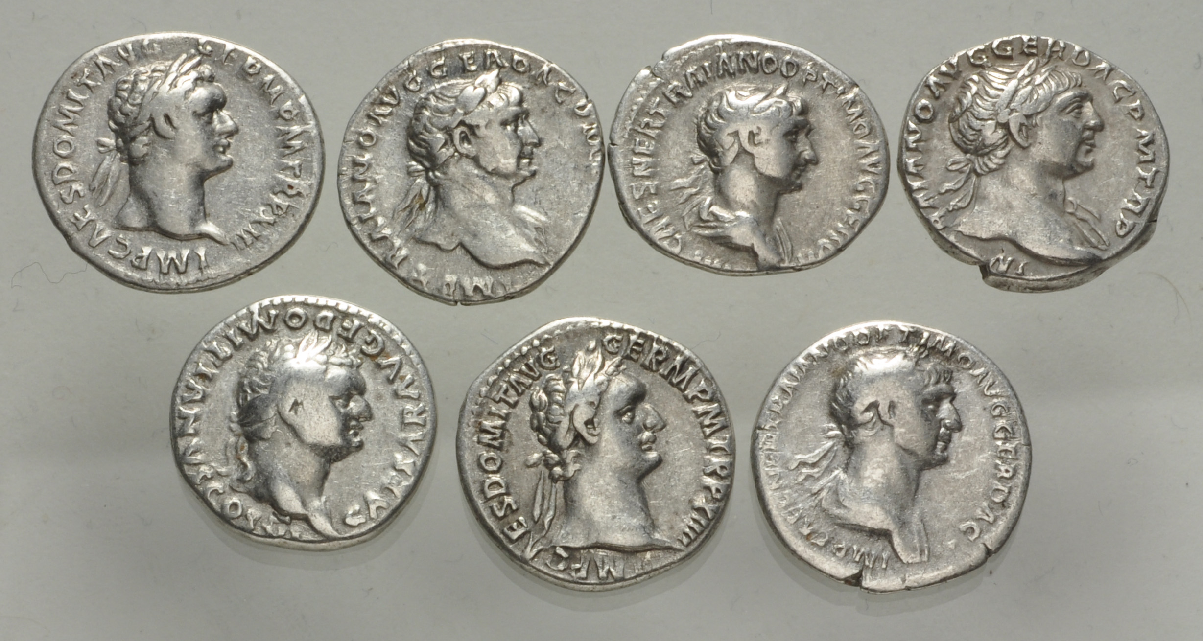 ROMAN. Imperial. Lot of seven (7) AR Denarii of Domitian and Trajan ...