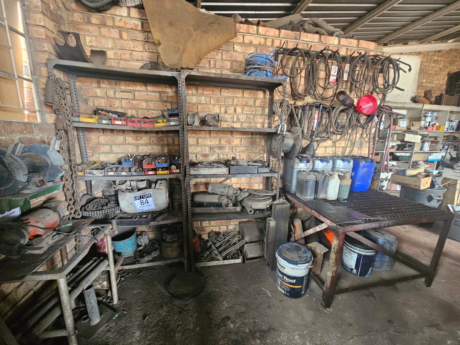 LOT OF TWO (2) STEEL RACKS WITH TABLE & VARIOUS WORKSHOP SPARES | Panabid